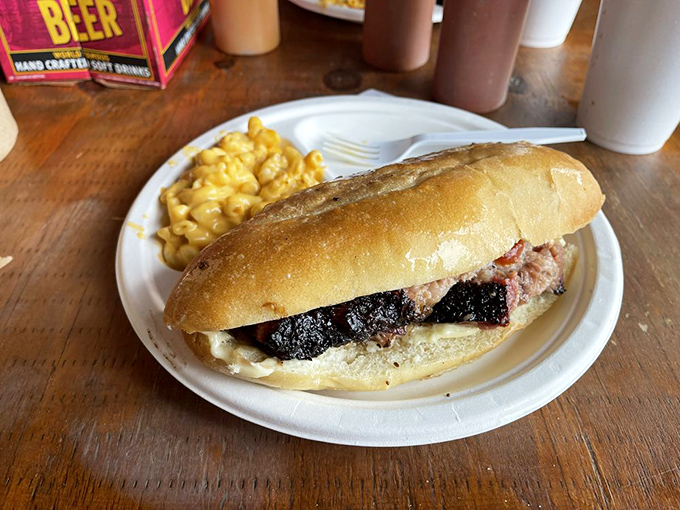 This brisket cheesesteak isn't just a sandwich &ndash; it's architecture, engineering, and art all wrapped in a perfect roll with mac and cheese standing guard.