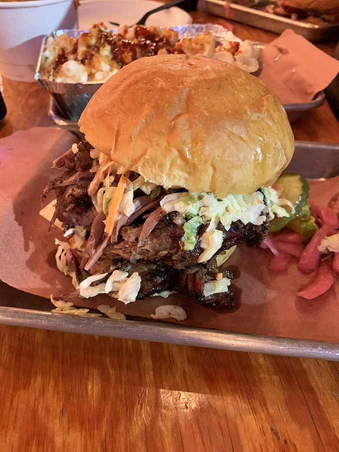 This isn't just a sandwich&mdash;it's architecture. Layers of brisket and coleslaw create a towering monument to what happens when meat meets patience.