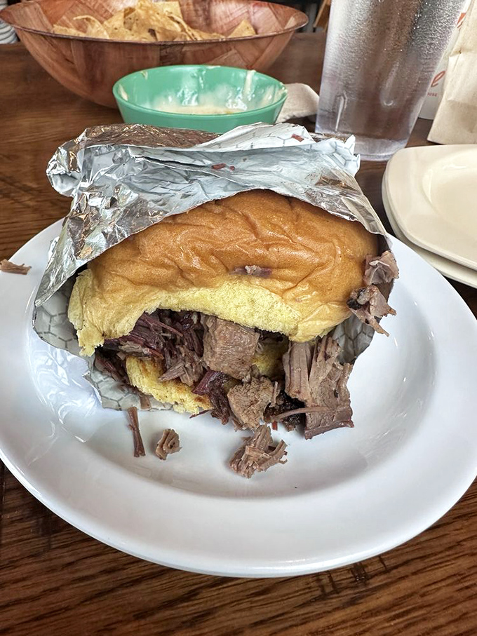 This brisket sandwich isn't just a meal, it's an event&mdash;tender, smoky meat practically falling out of its bun in delicious surrender.