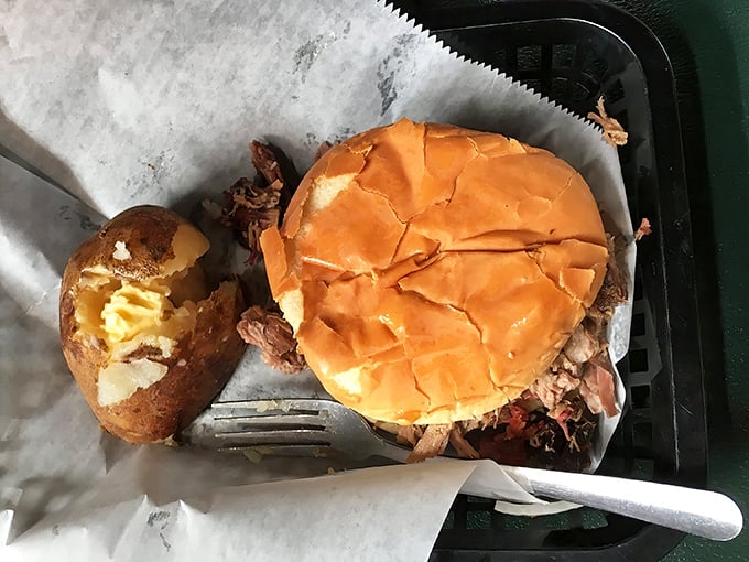 This brisket sandwich towers like edible architecture, promising flavors that justify the impressive construction.