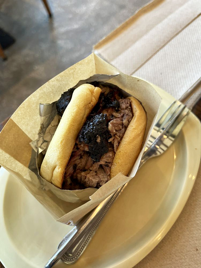 Brisket sandwich simplicity that speaks volumes. The bark on that meat is the equivalent of a smoky sonnet.