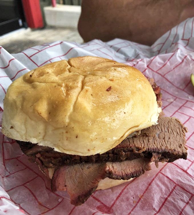 Brisket sliced so perfectly it practically poses for its portrait, nestled in a bun that's somehow both sturdy and cloud-like.