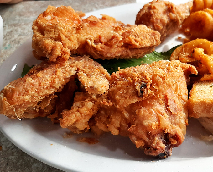 Golden, crispy perfection that Colonel Sanders would salute. This broasted chicken might just be worth crossing Paradise for.