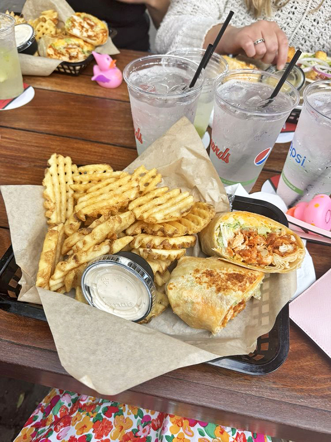 Waffle fries and wraps&mdash;the dynamic duo of lakeside dining. That little pink rubber duck knows it's watching over culinary greatness.