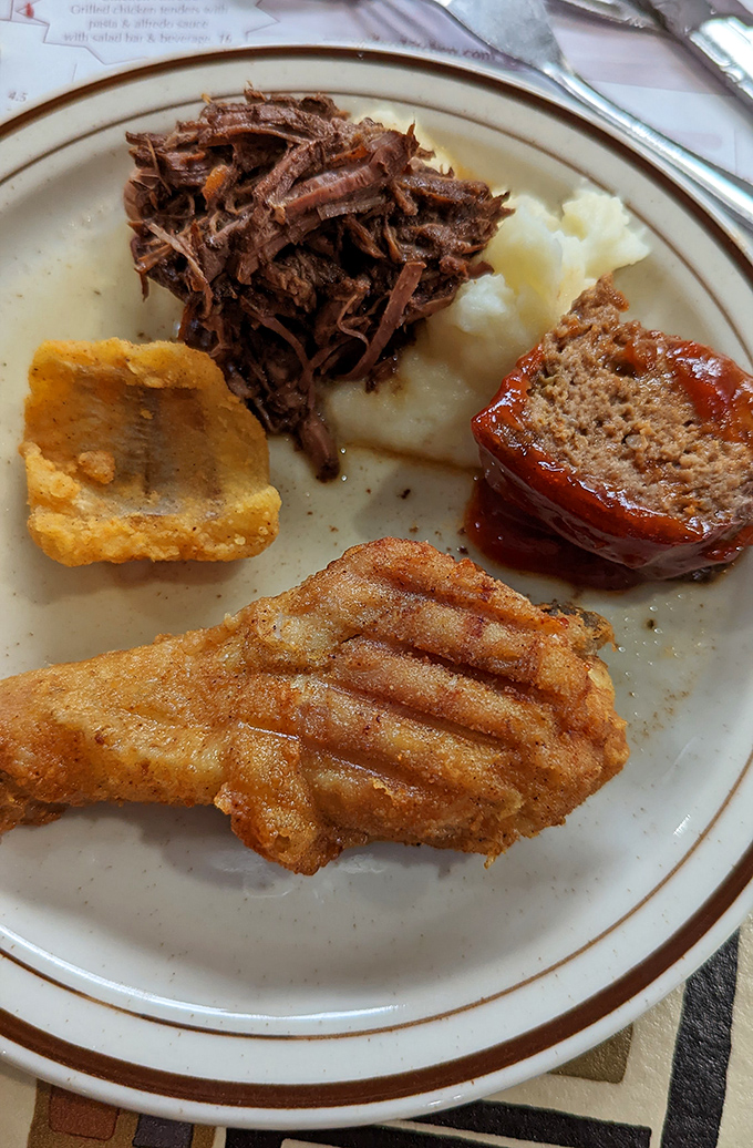 A buffet plate showcasing the greatest hits album of Amish country cooking &ndash; meat, potatoes, and zero pretension.