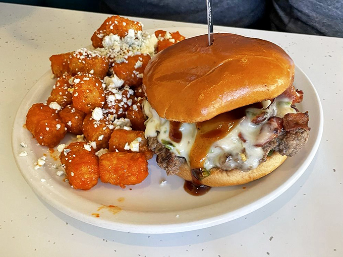 Burger perfection paired with sweet potato fries dusted with what can only be described as "sprinkle magic." A plate that demands to be photographed before it disappears.