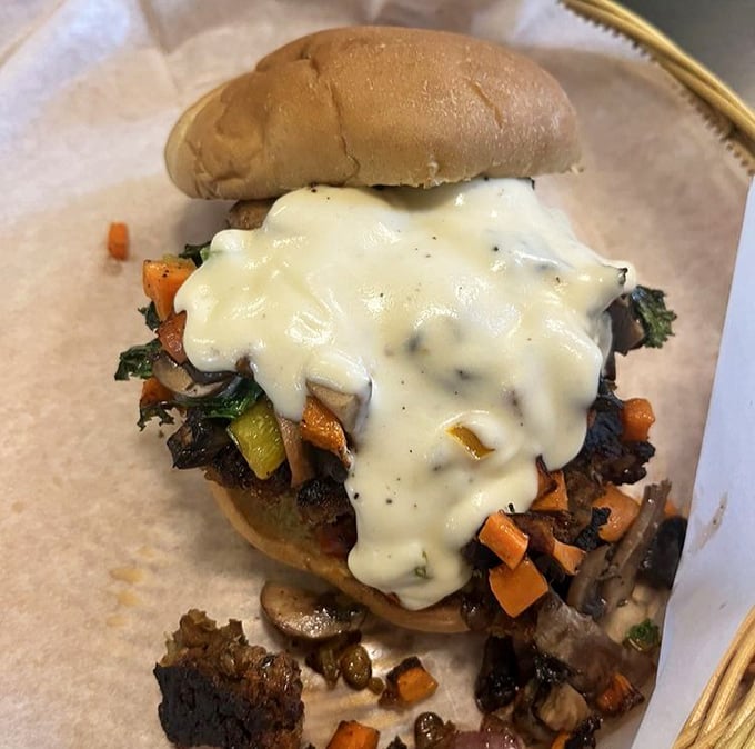 This isn't just a veggie burger&mdash;it's a masterpiece of melted cheese cascading over perfectly roasted vegetables like a dairy waterfall.
