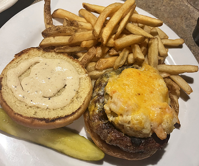 This isn't just a burger; it's a masterpiece of melted cheese, perfectly seasoned beef, and a bun that somehow manages to hold this beautiful chaos together.