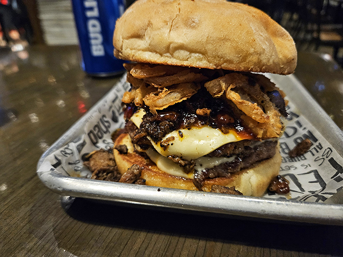 This isn't just a burger&mdash;it's an architectural marvel of beef, cheese, and toppings that requires both hands and possibly a building permit. 