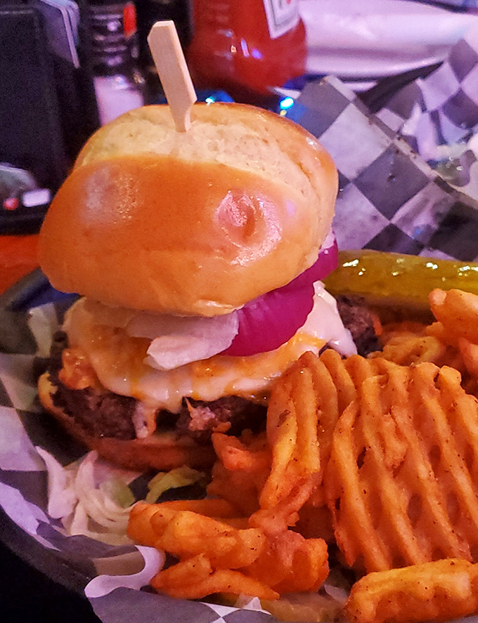 A burger so photogenic it should have its own Instagram account, complete with those golden crispy fries.