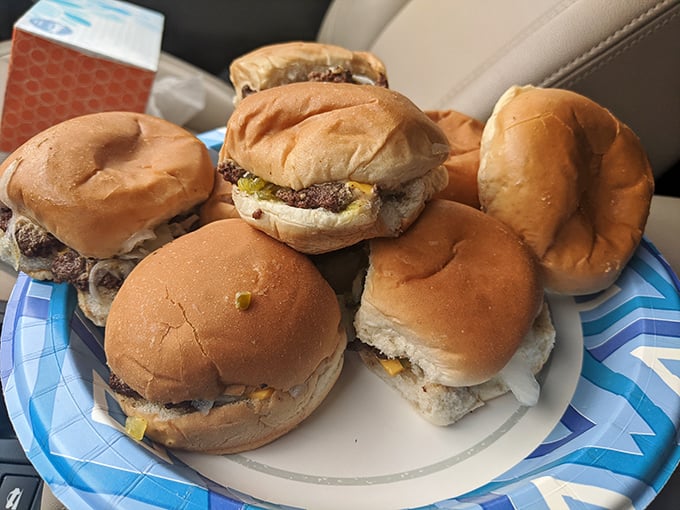 Slider perfection in its natural habitat. These aren't just burgers; they're edible time machines to when food was honest and gloriously unpretentious.