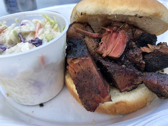 Burnt ends sandwich with creamy coleslaw&mdash;proof that the best things in life come from patience, smoke, and knowing when not to mess with perfection.