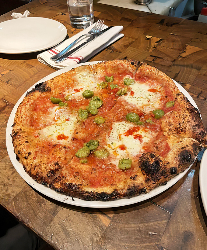 Wood-fired perfection with a blistered crust that crackles like vinyl records&mdash;this pizza makes you question every slice you've had before.