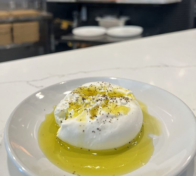 Burrata: where cheese transcends to art form. That pool of olive oil is practically begging for a bread dive.