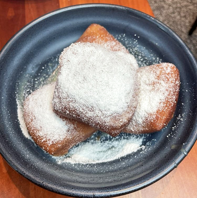 These beignets aren't just dusted with powdered sugar&mdash;they're practically wearing winter coats of it. Each bite offers that perfect contrast between crisp exterior and pillowy center.