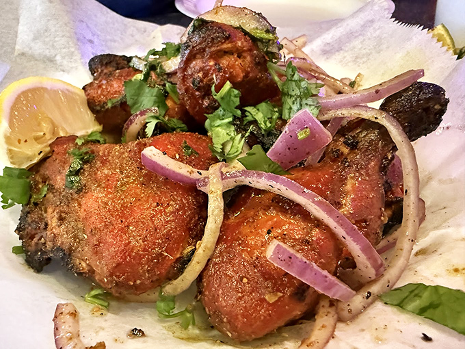 Tandoori chicken that's had a proper introduction to fire&mdash;charred edges, vibrant color, and a sprinkle of herbs that means business.
