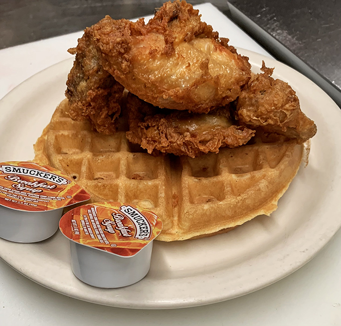 Chicken and waffles: the ultimate breakfast compromise for when you can't decide between dinner and breakfast. Golden, crispy perfection meets fluffy waffle canvas.