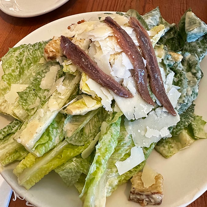 The Caesar salad arrives like Roman nobility&mdash;whole leaf romaine adorned with anchovy fillets and shaved Parmesan, no plebeian chopped salad here.