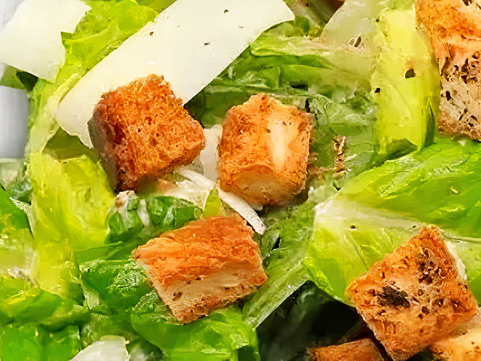 Even Caesar would bow to this salad&mdash;crisp romaine, golden croutons, and shavings of parmesan that add just enough civilization to your meat feast.