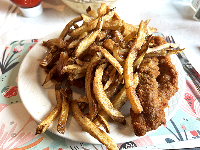 These crispy fries arrive seasoned like they're auditioning for a Cajun dance troupe.