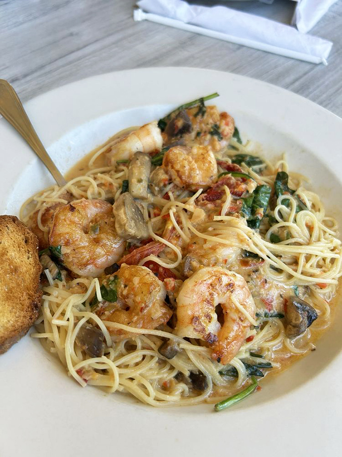 Pasta perfection: plump shrimp nestled among al dente noodles in a creamy sauce that somehow manages to be rich without overwhelming.