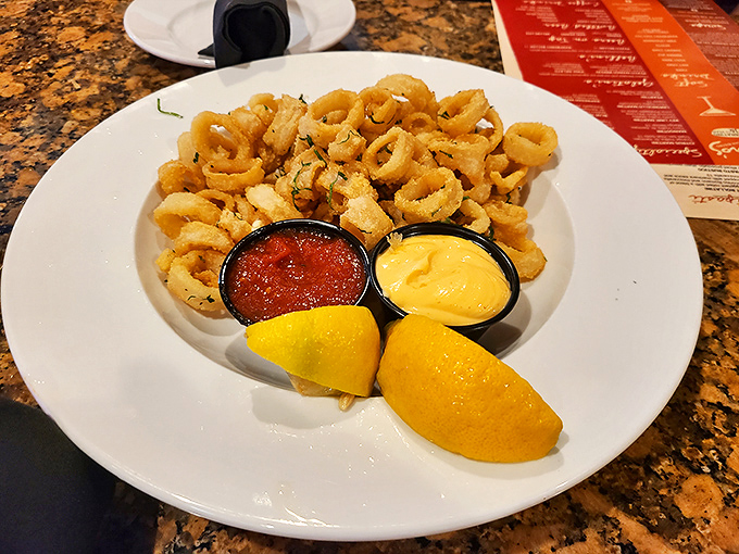 Crispy calamari that doesn't require an Olympic-level jaw workout&mdash;served with marinara and aioli for double-dipping delight.