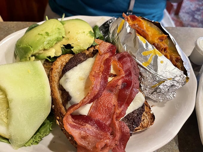 When your burger needs bacon and avocado and comes with a loaded baked potato, lunch just became an event.