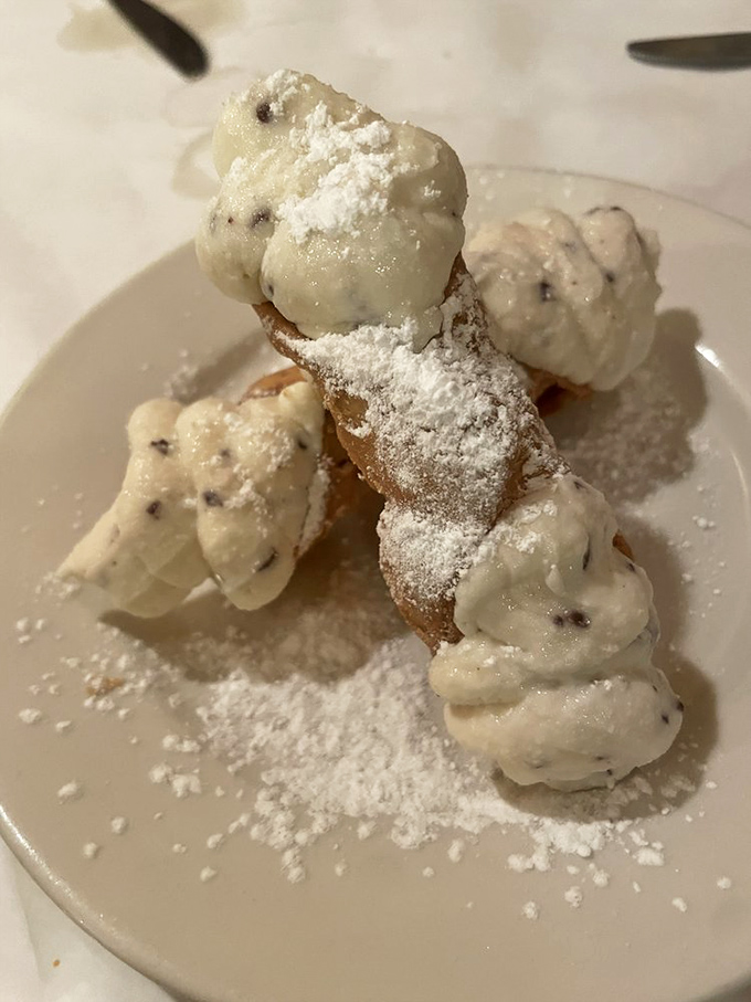 This cannoli doesn't just have filling &ndash; it has attitude. The crisp shell shatters with purpose, revealing a sweetened ricotta that's impossibly light yet deeply satisfying.