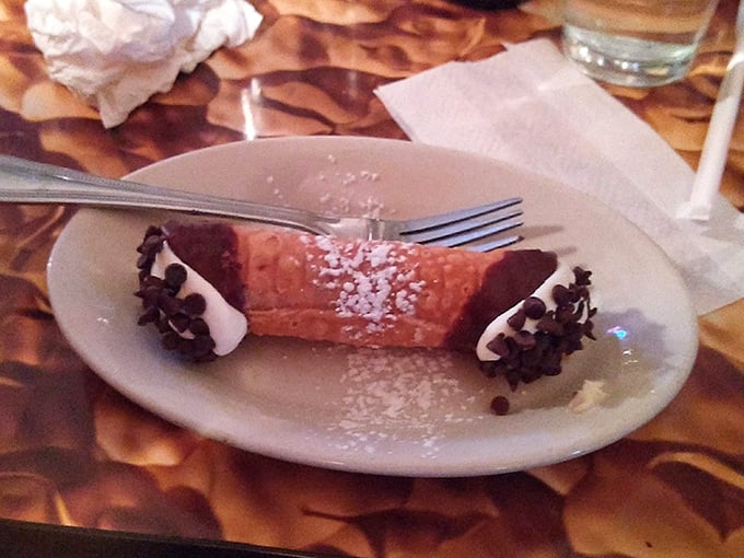 Cannoli that would make any Sicilian grandmother nod in approval &ndash; crisp shell, creamy filling, and those chocolate chips adding the perfect finishing touch.