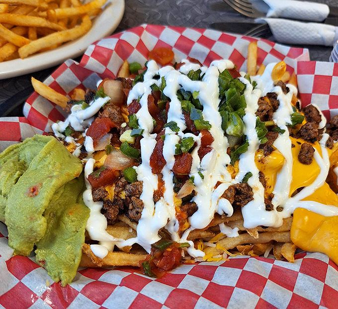 Loaded carne asada fries that don't know the meaning of restraint &ndash; a glorious mess of cheese, meat, and toppings that demands to be shared.
