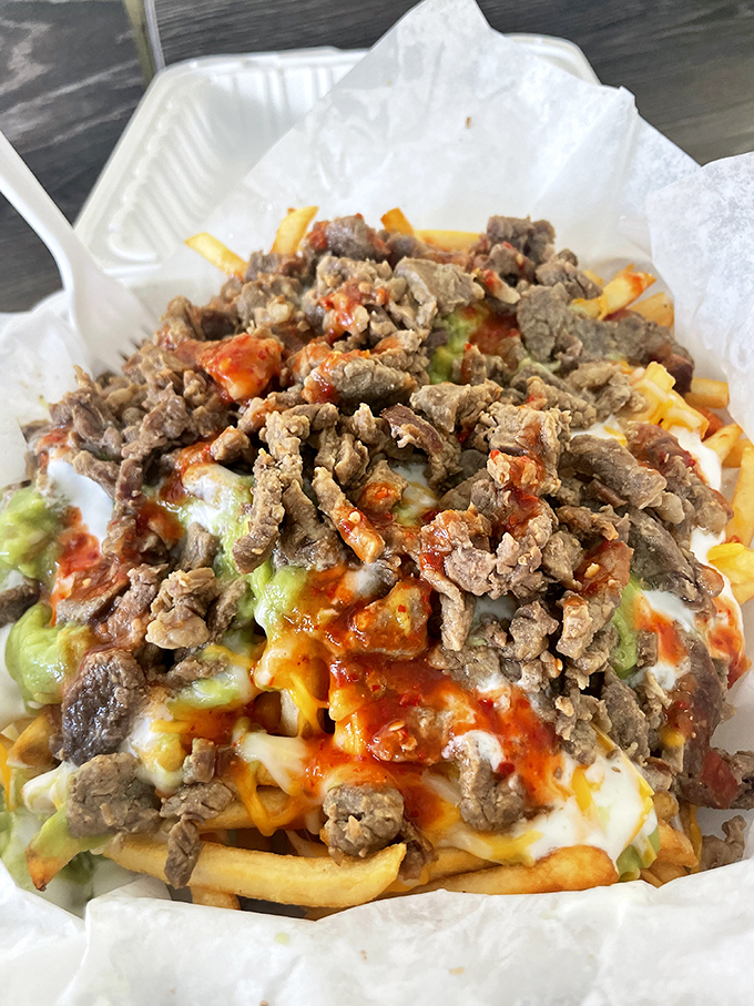 Carne asada fries: where French fries decided to dress up for the most delicious black-tie event in San Diego.