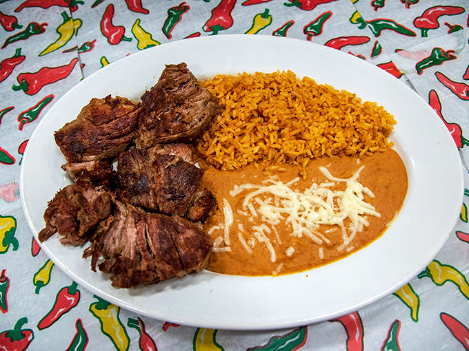 These carnitas don't just fall apart&mdash;they surrender with dignity to your fork after a long, flavorful braise. The beans aren't bad company either.