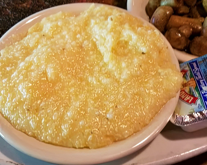 Cheese grits that would make a Southerner weep with joy. That golden pool of comfort isn't just a side dish&mdash;it's practically a religious experience in a bowl.