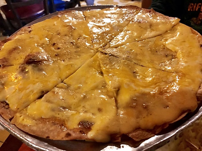 The cheese crisp: Arizona's answer to pizza. Crispy, cheesy, and utterly addictive—resistance is futile, your diet can restart tomorrow.