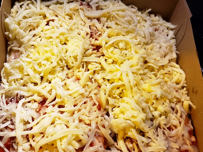 Cheese pizza that proves less is more. That golden blanket of melted perfection is the comfort food equivalent of a warm hug.