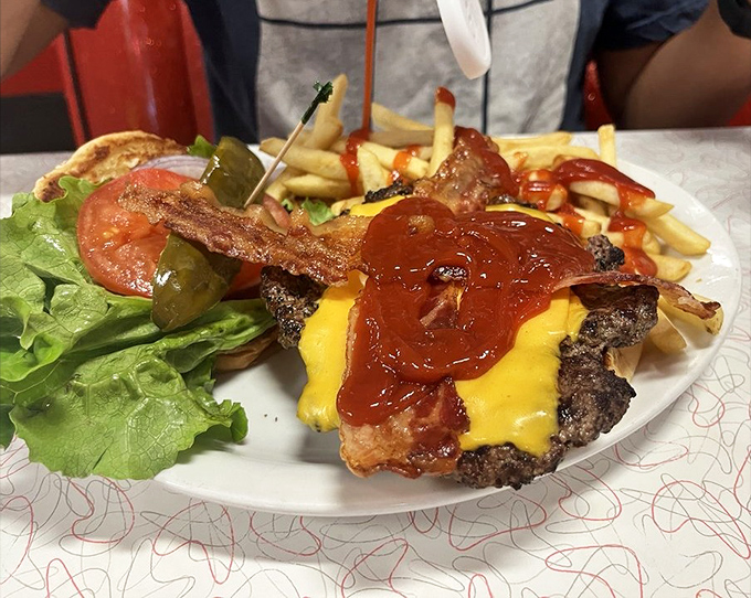 This isn't just a cheeseburger; it's an architectural marvel of beef, cheese, and toppings that requires both hands and zero shame.