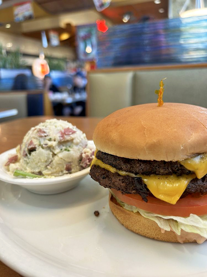 This isn't just a cheeseburger; it's a monument to American ingenuity. Two perfectly charred patties with melted cheese that cascades like a yellow waterfall of joy.