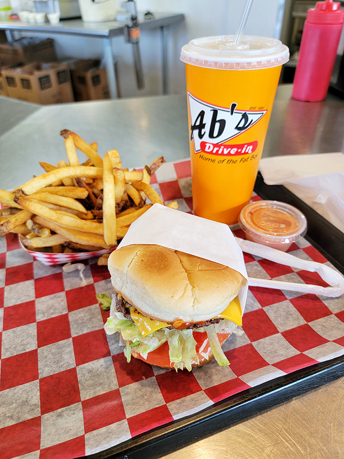 The Fat Boy burger, hand-cut fries, and signature drink – the holy trinity of American drive-in perfection.