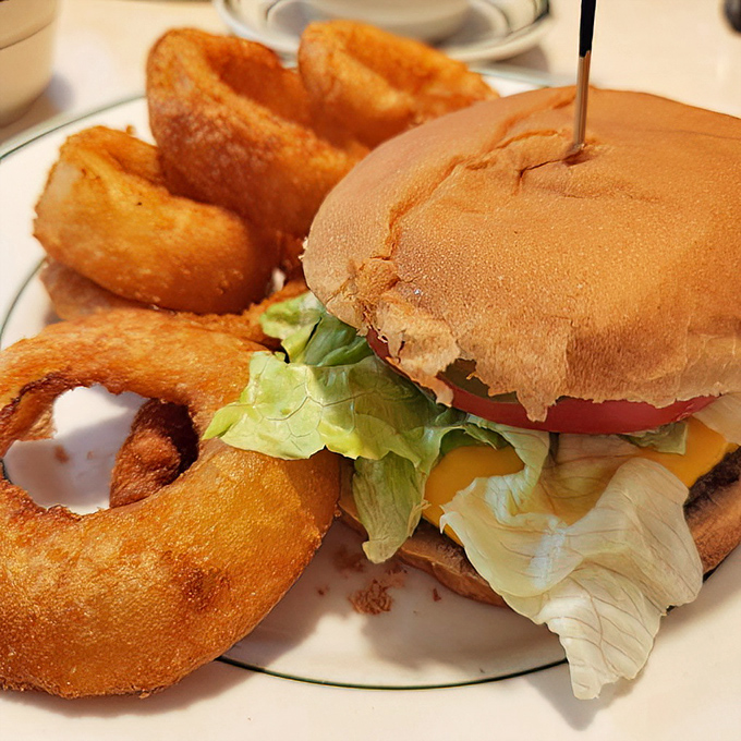 The perfect diner burger doesn't exi&mdash; Oh wait, here it is! Crispy onion rings standing guard around a sandwich that remembers what fast food forgot.