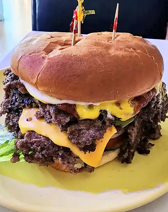 This towering masterpiece could make a vegetarian question their life choices&mdash;layers of beef, cheese, and pure satisfaction.