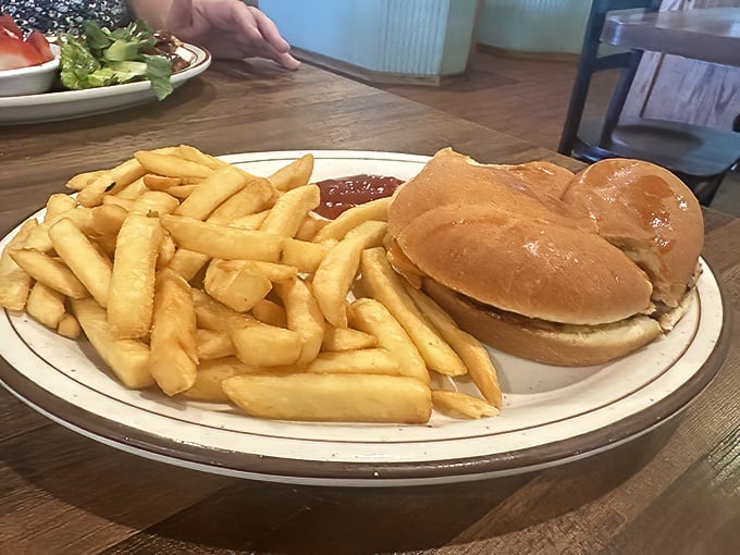 The burger arrives with fries standing at attention, as if they know they're in the presence of beef royalty.