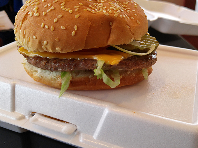 This isn't just a burger; it's architecture. Notice how the melted cheese creates that perfect seal between beef and bun.
