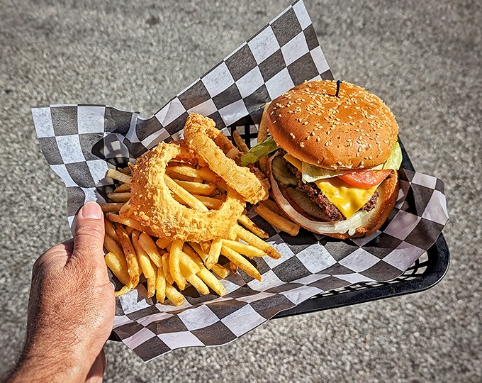 That golden cheeseburger with crispy onion rings and fries proves some combinations are simply too perfect to mess with or improve upon.