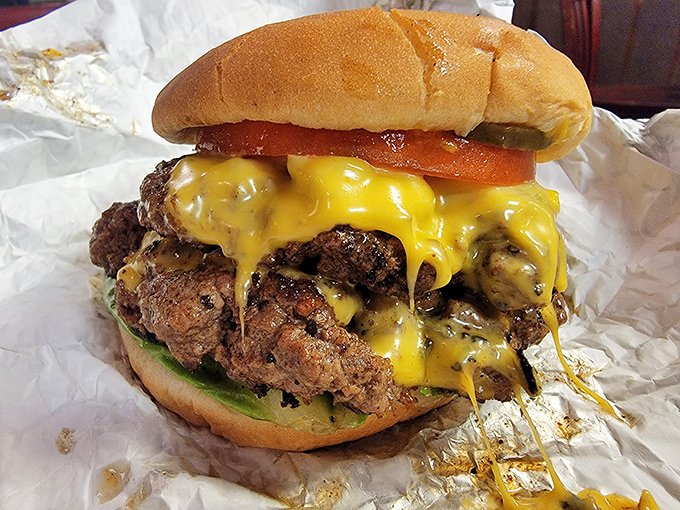 Behold the cheeseburger that launched a thousand road trips &ndash; juicy, messy, and demanding to be eaten with both hands and zero regrets.