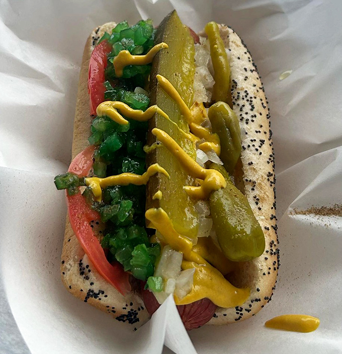 The Chicago dog&mdash;a work of art where yellow mustard zigzags across a garden of toppings like edible sunshine.