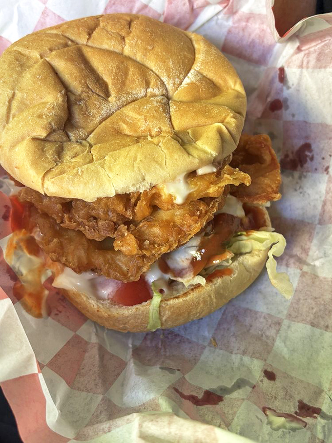 Layer upon layer of crispy chicken tenderloin stacked between a humble bun &ndash; proof that sometimes the best architecture is edible. 