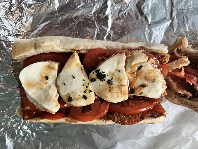 "A masterpiece in simplicity: fresh mozzarella melting over ripe tomatoes and crispy chicken cutlet, all nestled in that perfect Philly roll. Sandwich poetry.
Add to Conversation"