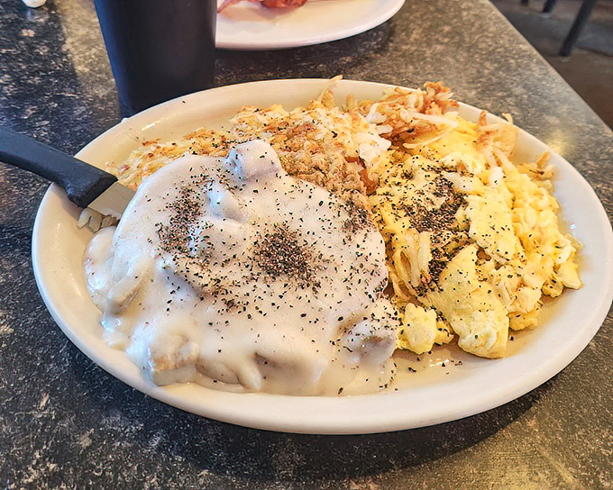 Country gravy that could make a vegetarian question their life choices, smothering eggs that never had it so good.