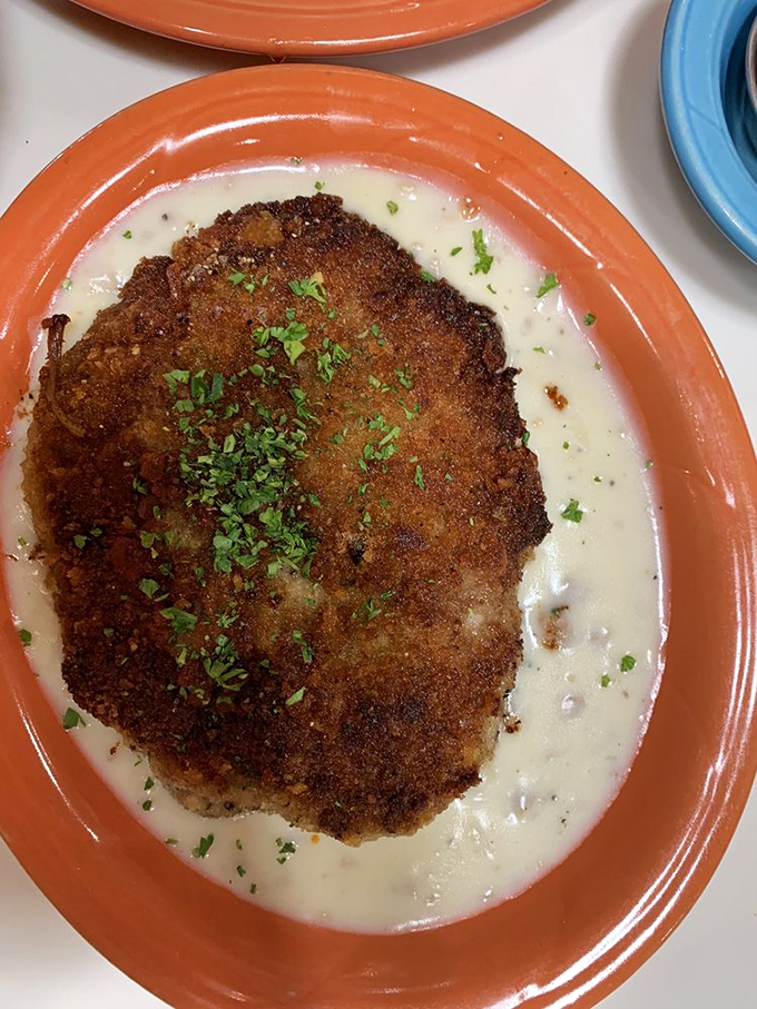 This chicken fried steak isn't just comfort food &ndash; it's a warm, crispy hug on a plate. The cream gravy deserves its own fan club.