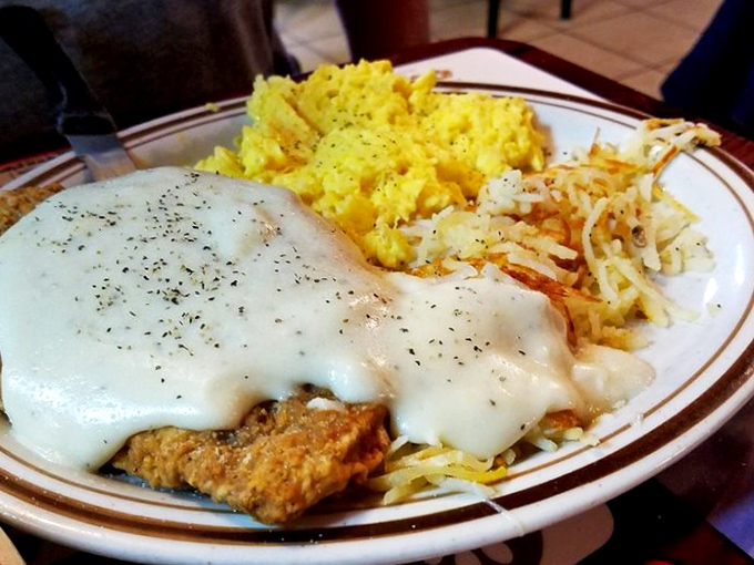 Country fried steak smothered in gravy with eggs and hash browns&mdash;the breakfast equivalent of a warm hug from someone who truly understands you.